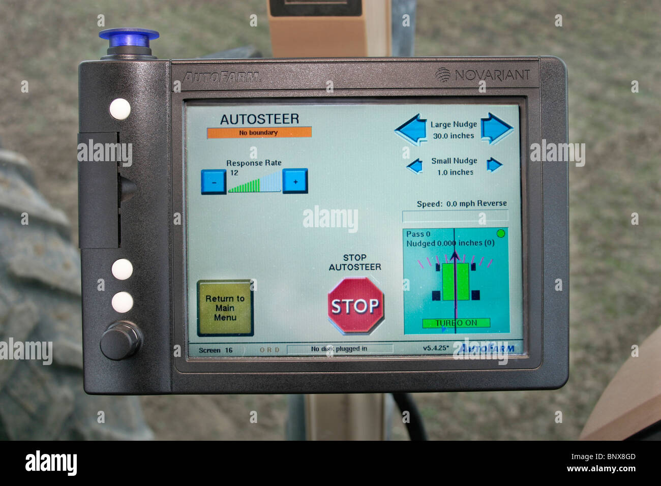A tractor driver with GPS navigation for accurate field grading Stock ...