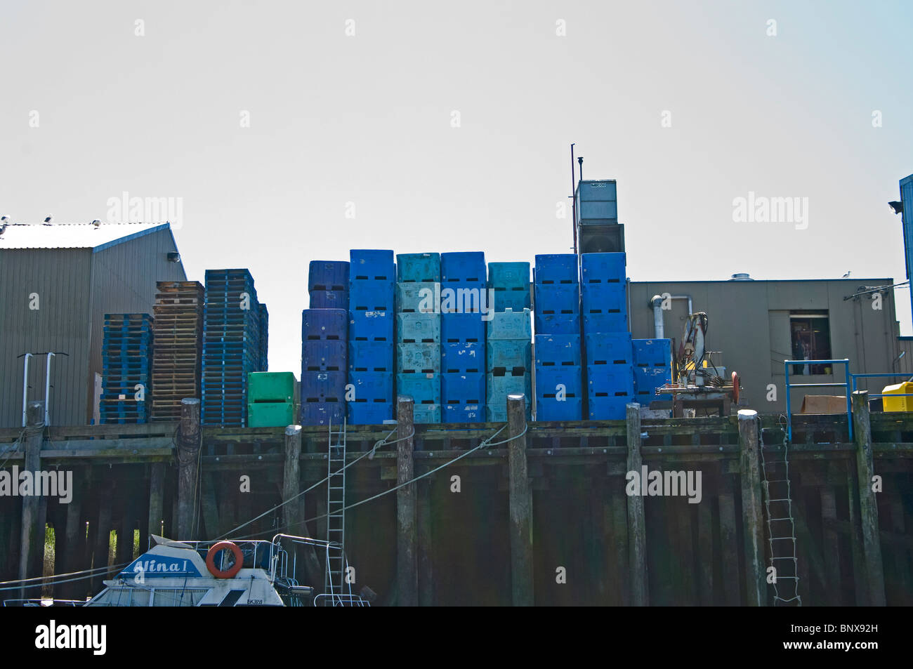 Fish totes on wharf Stock Photo - Alamy