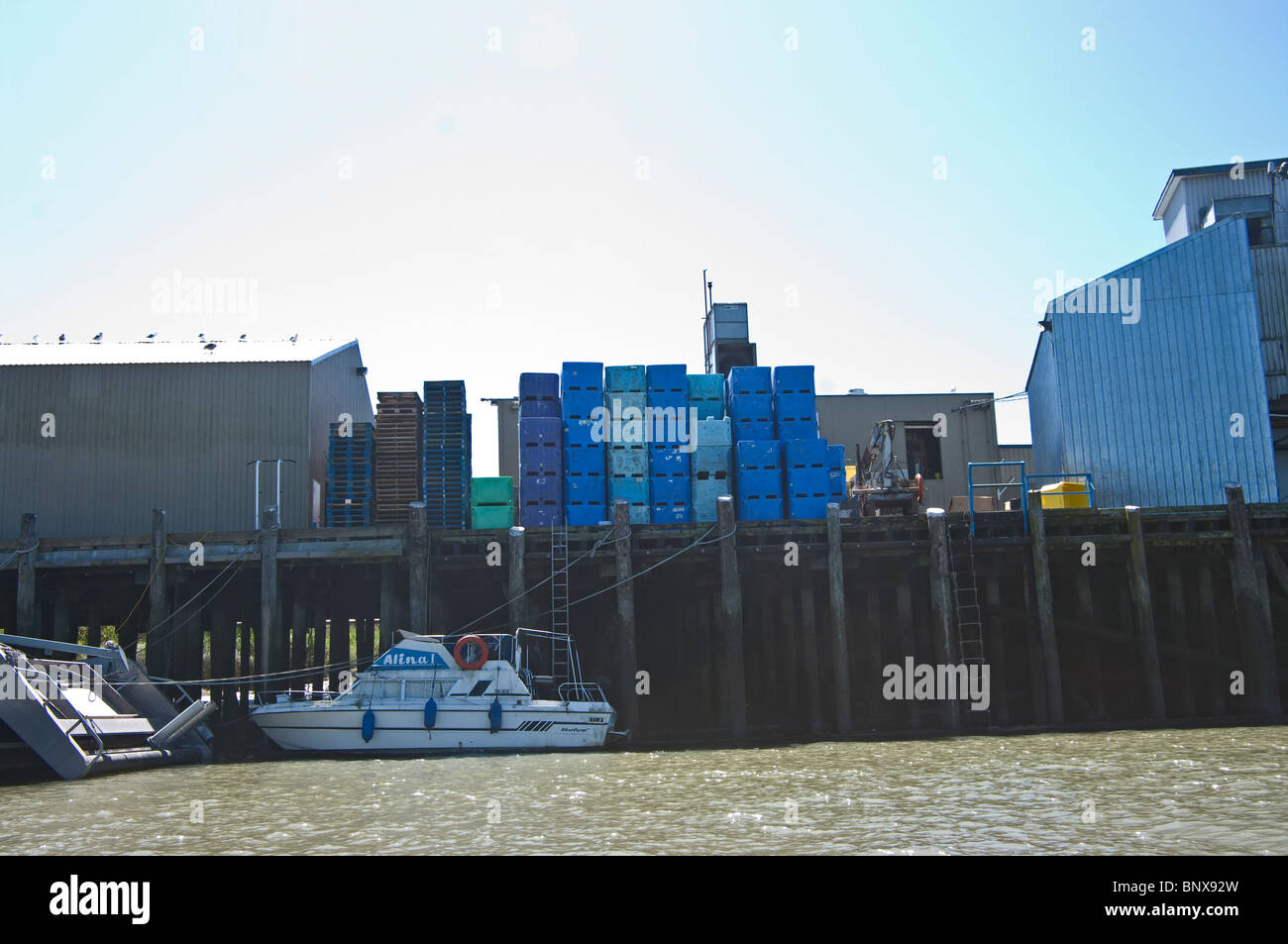 Fish totes on wharf Stock Photo - Alamy