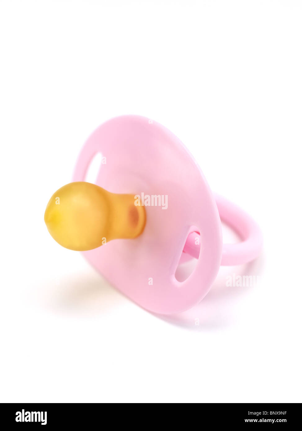 A pink pacifier Stock Photo - Alamy