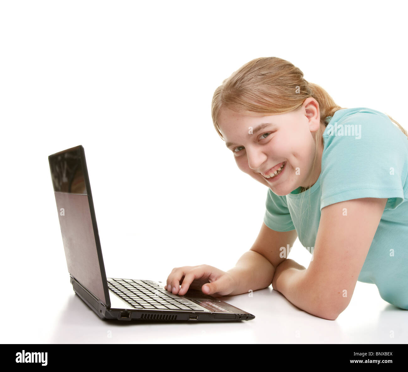 teenage girl using laptop isolated on white Stock Photo - Alamy
