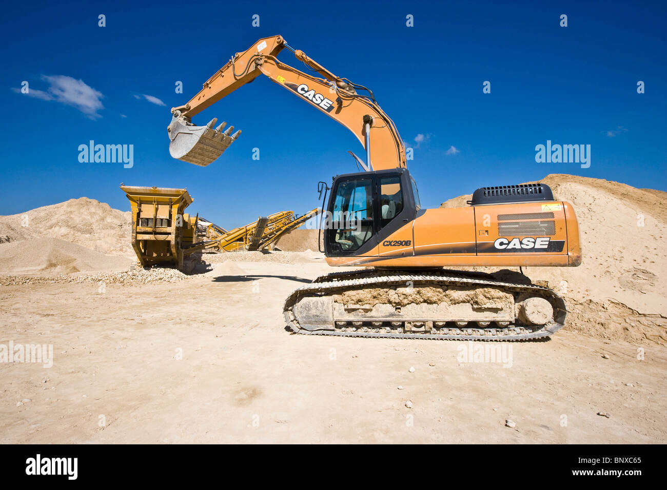 360 digger working in a quarry Stock Photo - Alamy