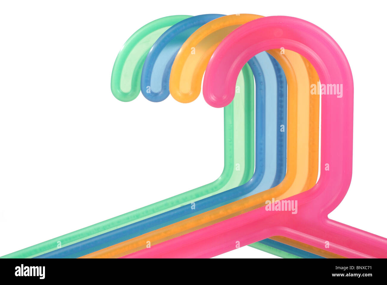 Coloured plastic hangers on a white background Stock Photo - Alamy