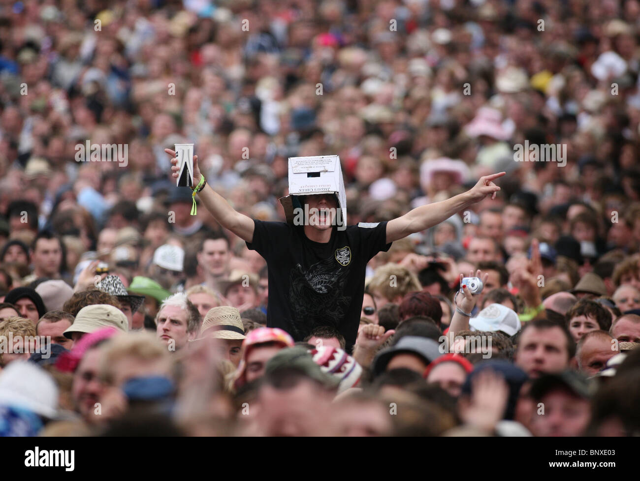 Boy in crowd on shoulders hi-res stock photography and images - Alamy