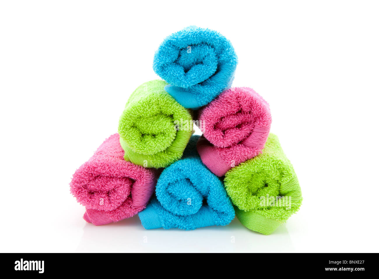 stack of colorful rolled towels isolated on white background Stock ...
