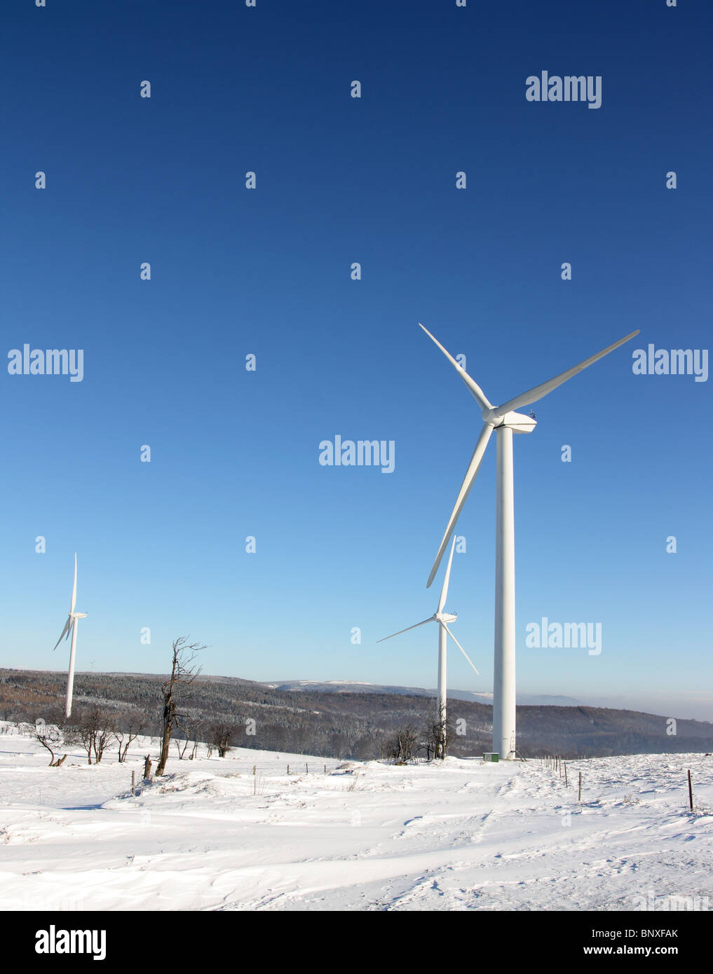Single wind turbine generating electricity in winter landscape Stock ...