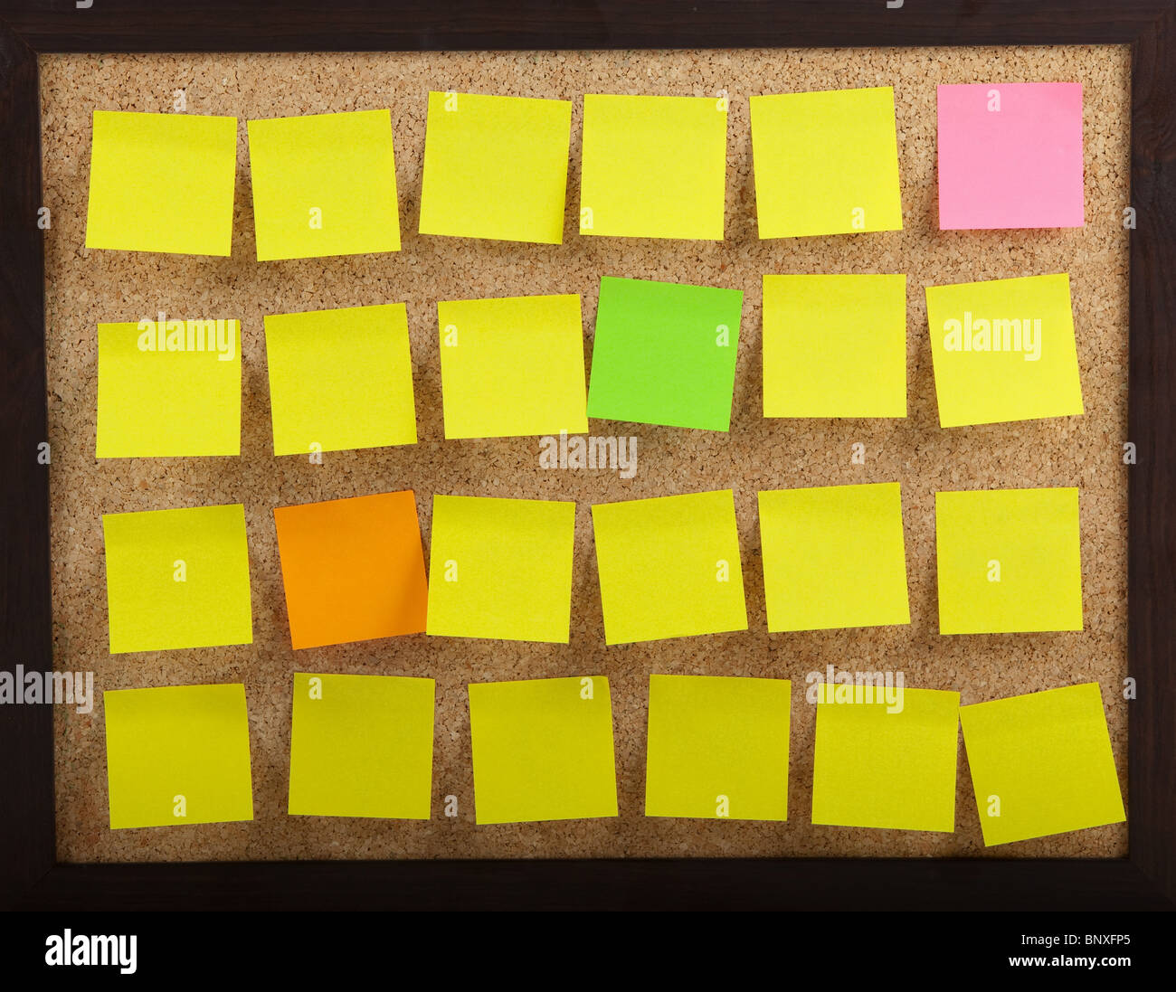 Colourful Notes On Brown Cork Board Stock Photo - Alamy
