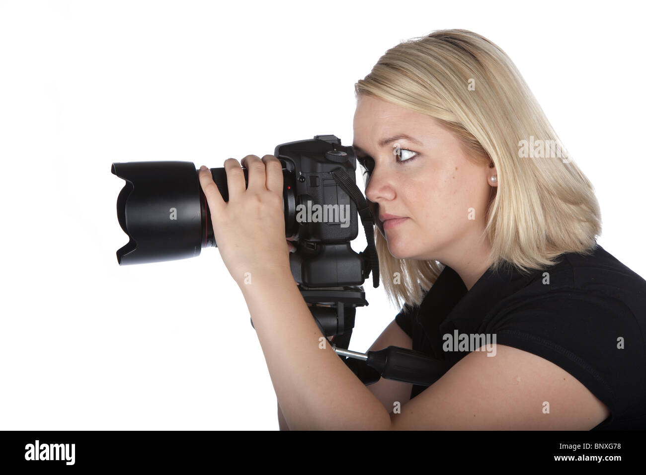 Beautiful Young Female Photographer Taking a Photo with Camera on a ...