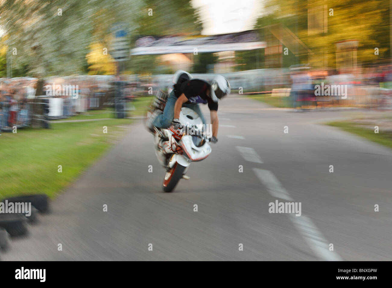 Crazy motorbike driver making tricks Stock Photo - Alamy