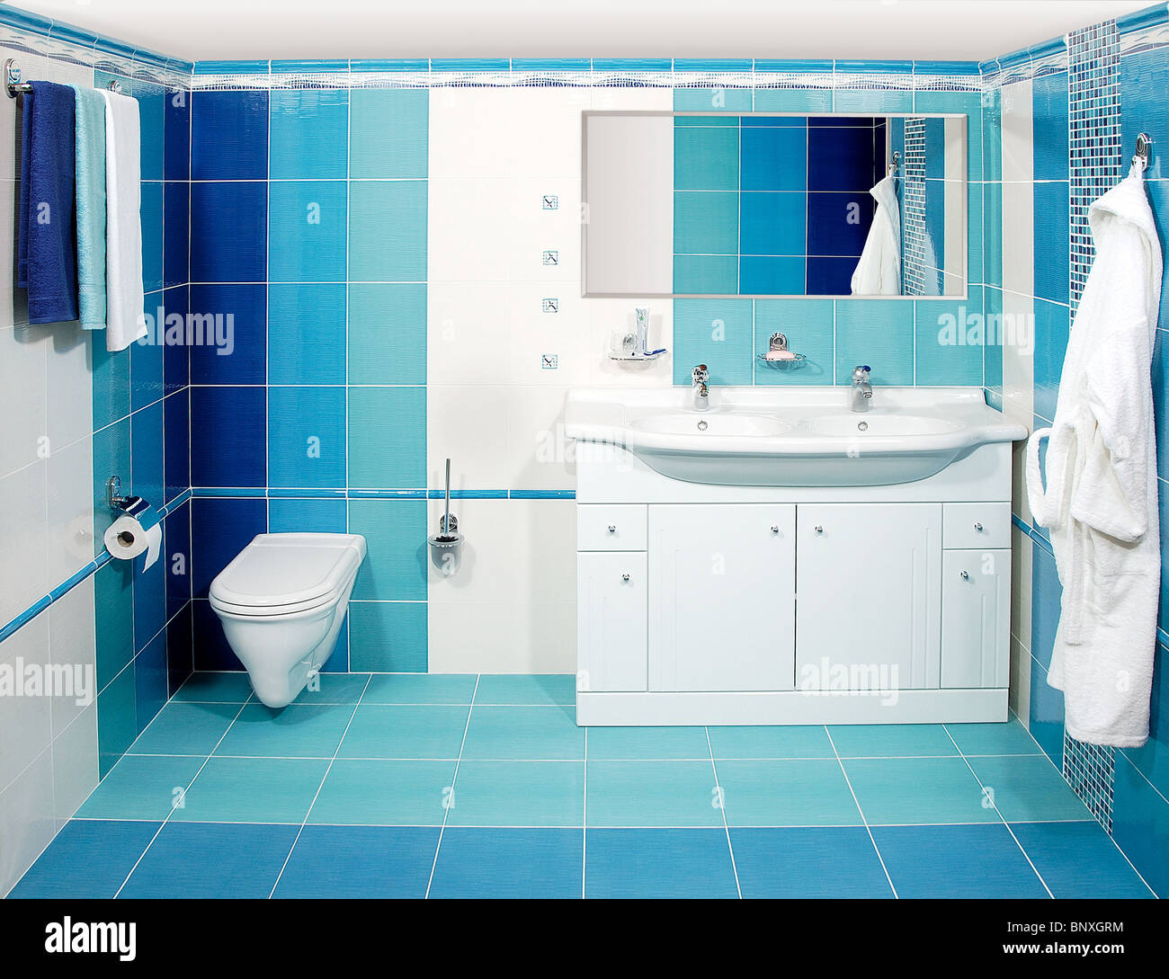 The luxury bathroom in blue with the bathrobe Stock Photo - Alamy