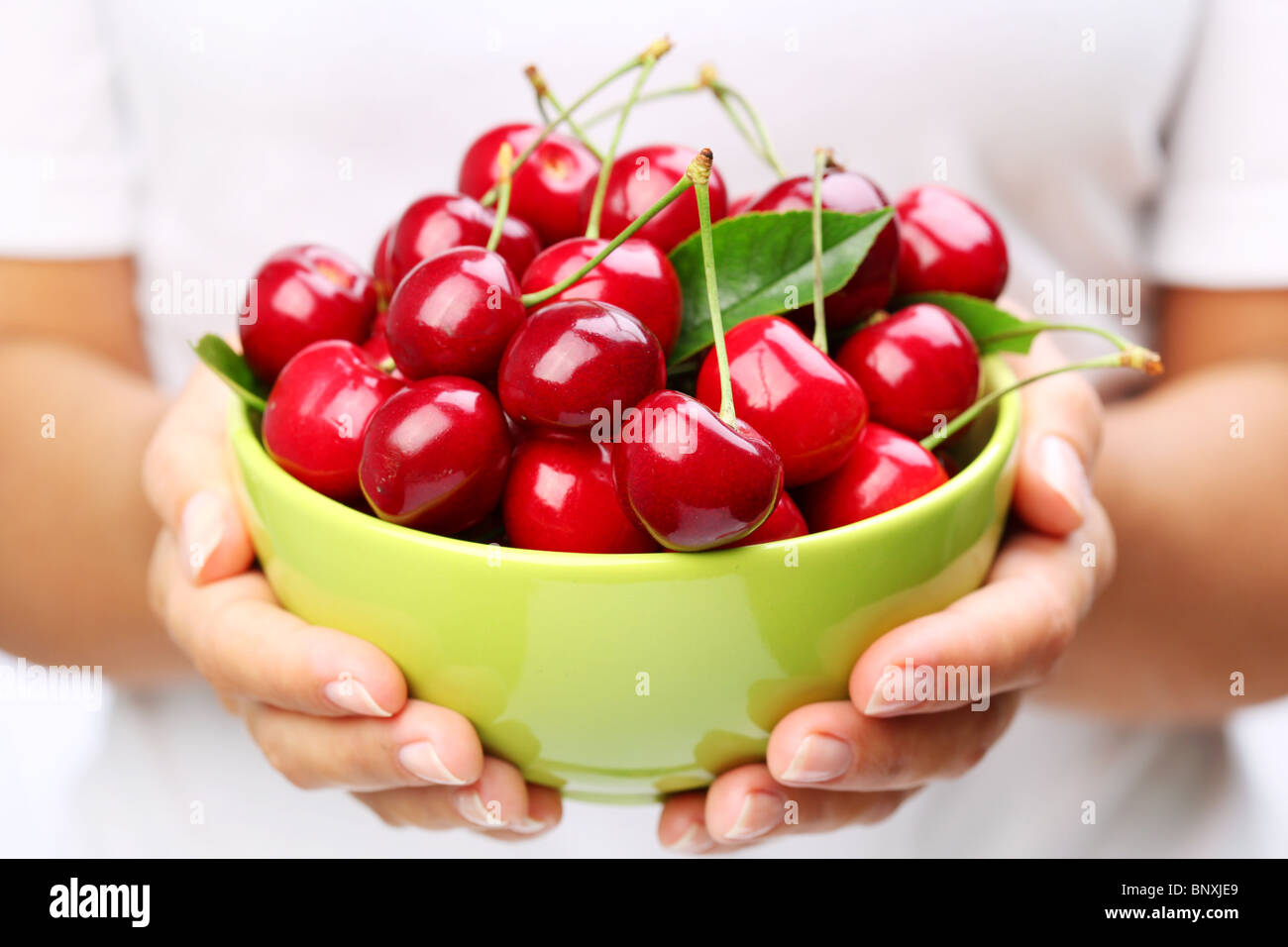 Hand with cherry hi-res stock photography and images - Alamy