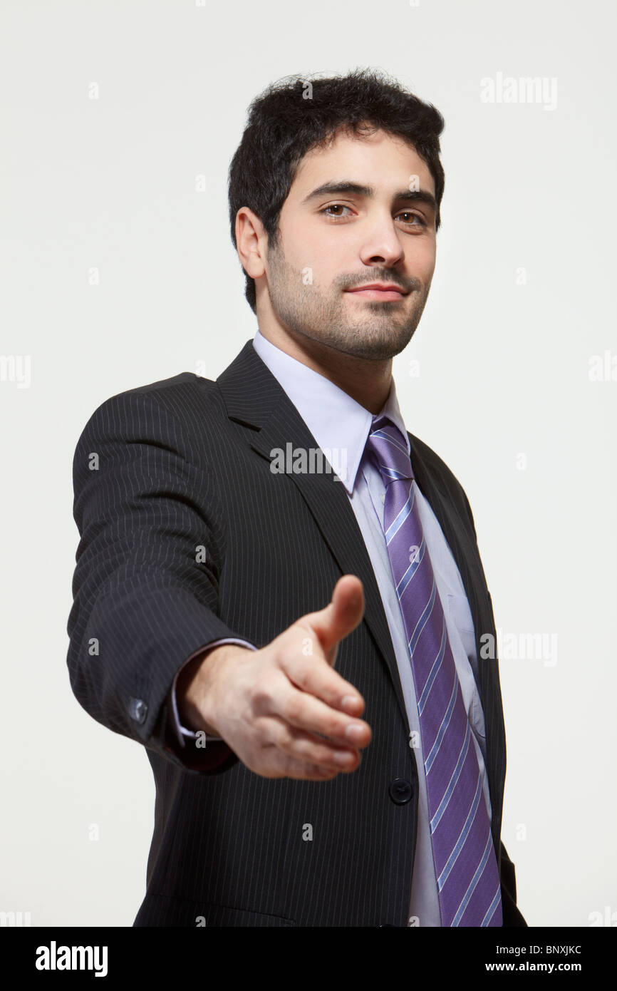 Business man offering handshake on white background Stock Photo - Alamy