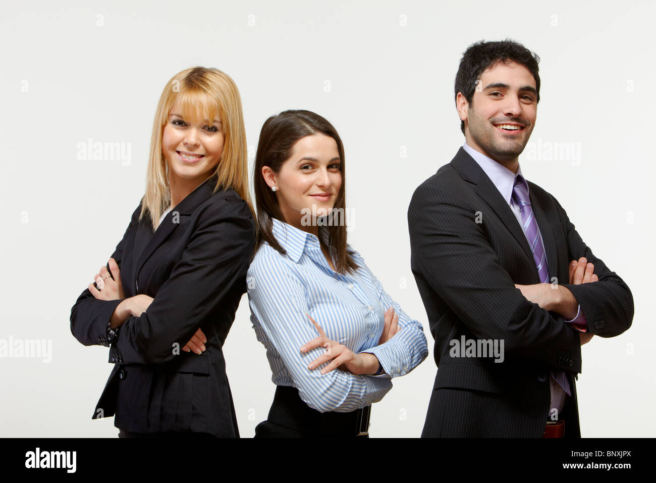 Good looking business people standing on white background with crossed ...
