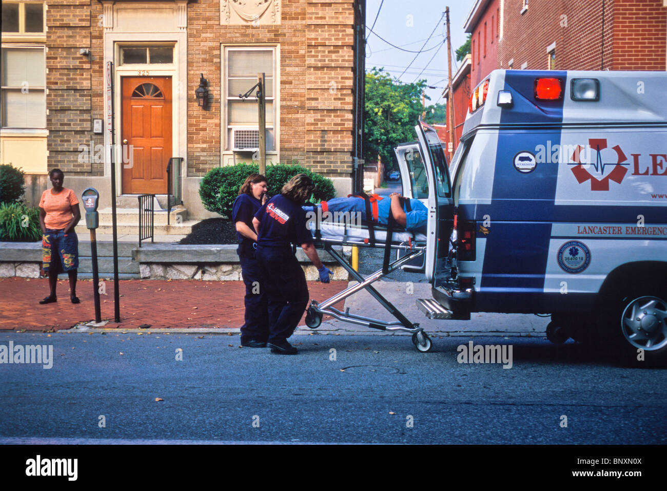 ambulance EMT emergency workers victim Stock Photo - Alamy