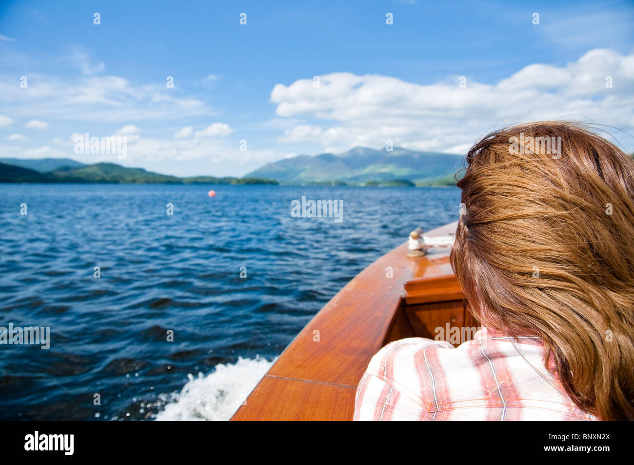 A Young Man, with the wind in his hair - looking out from a boat ...