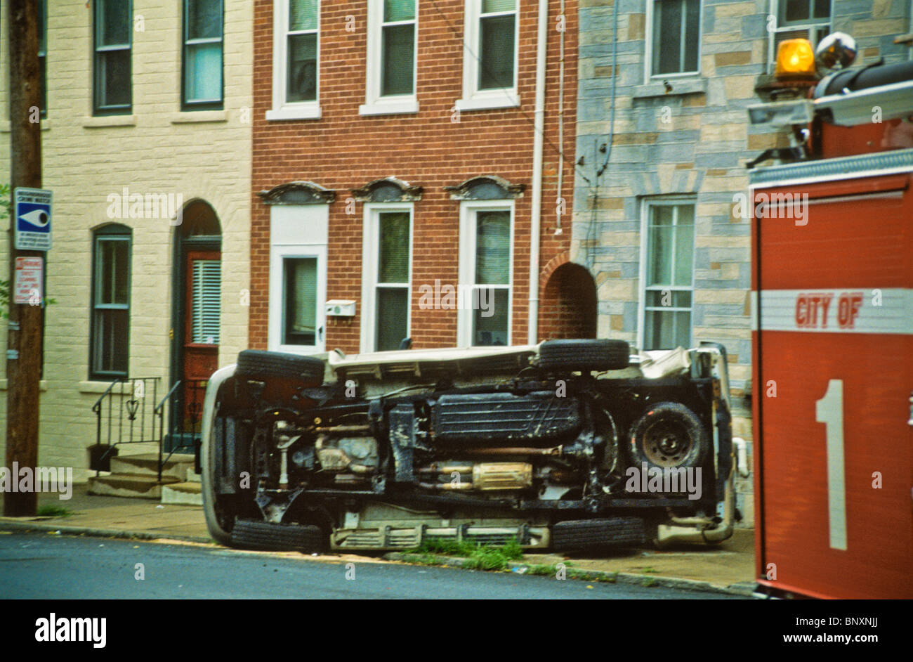 Over turned car at accident scene, police and fire truck Stock Photo ...