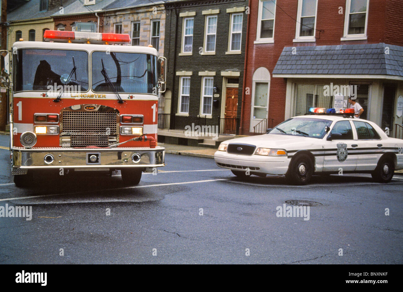 Over turned car at accident scene, police and fire truck Stock Photo ...