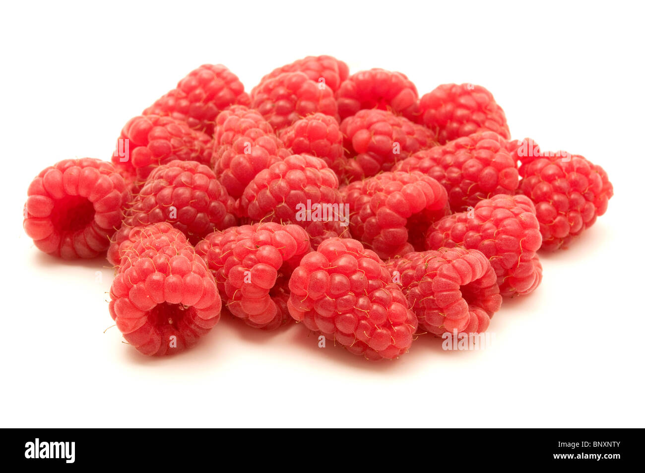 Raspberries on a white background Stock Photo - Alamy
