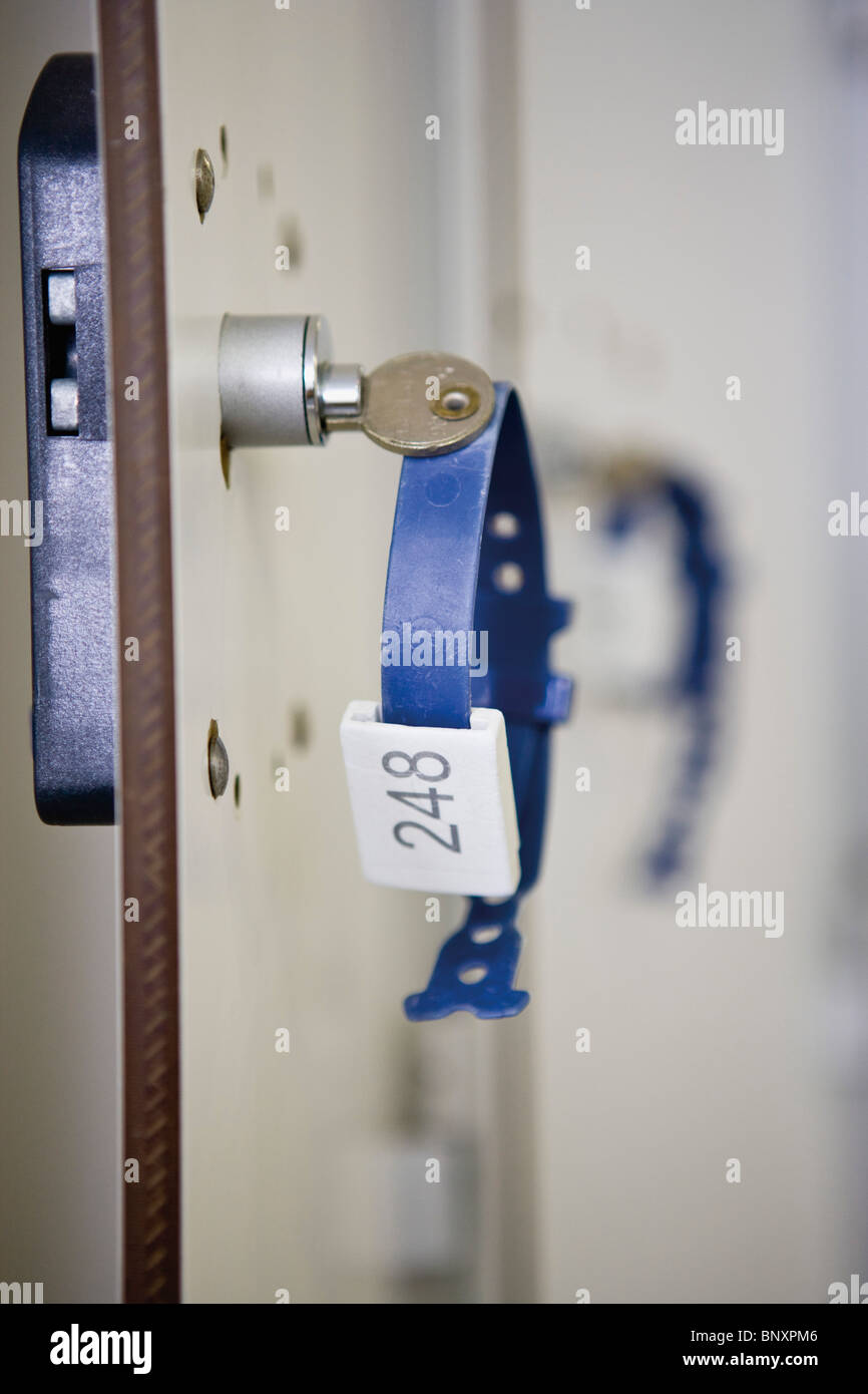 Key in locker door Stock Photo - Alamy