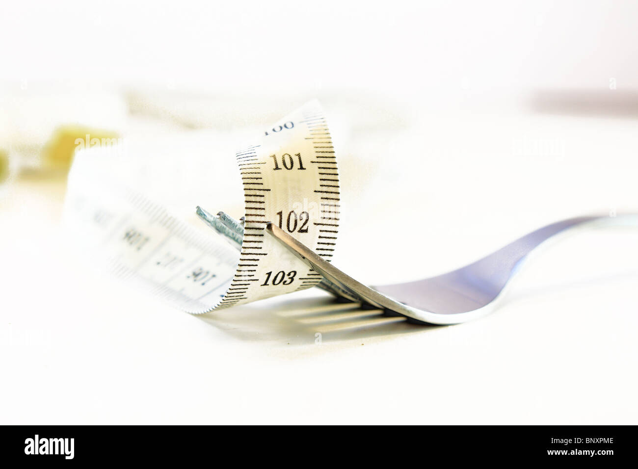 measuring tape and fork Stock Photo - Alamy