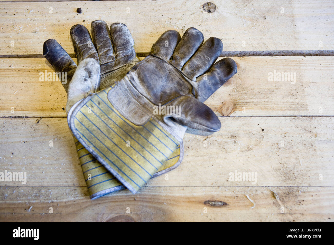 Pair of worn work gloves Stock Photo - Alamy