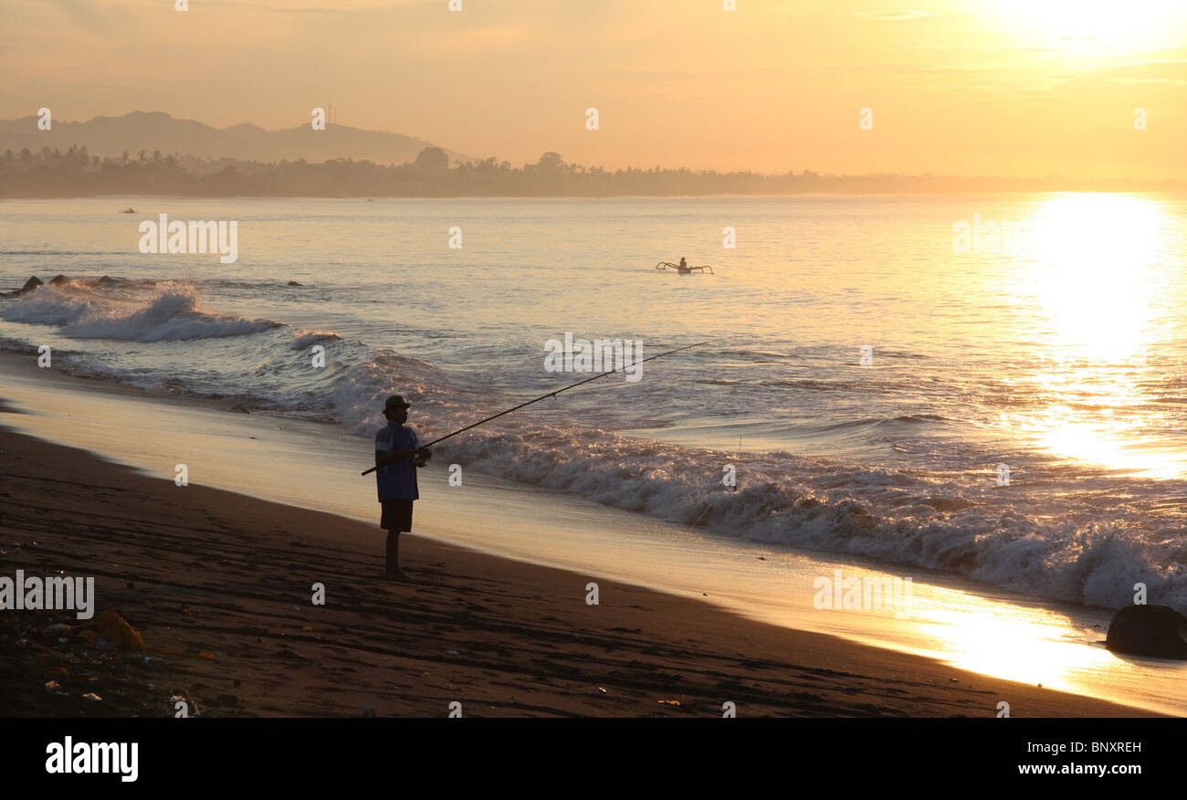 Fishing in sea waves Cut Out Stock Images & Pictures - Alamy