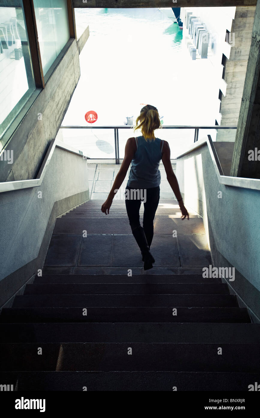 Walking down steps, rear view Stock Photo - Alamy