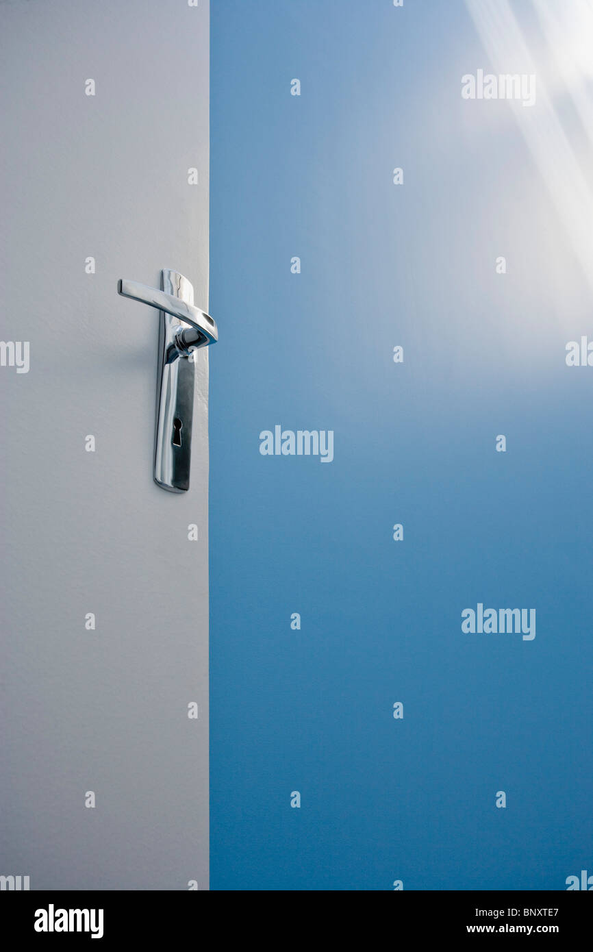 Open door with metal handle Stock Photo - Alamy