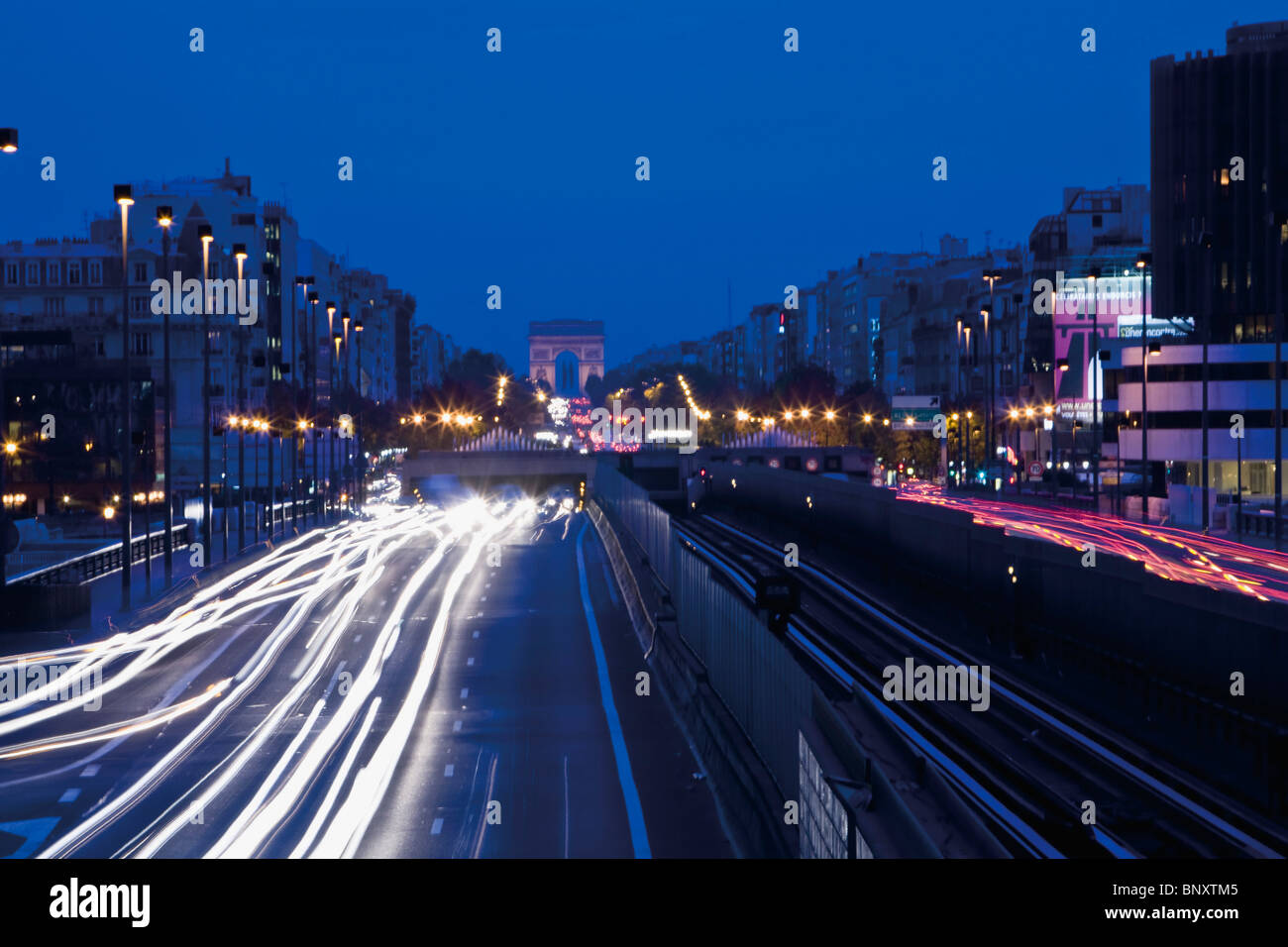 Light trails from traffic on busy urban freeway Stock Photo - Alamy