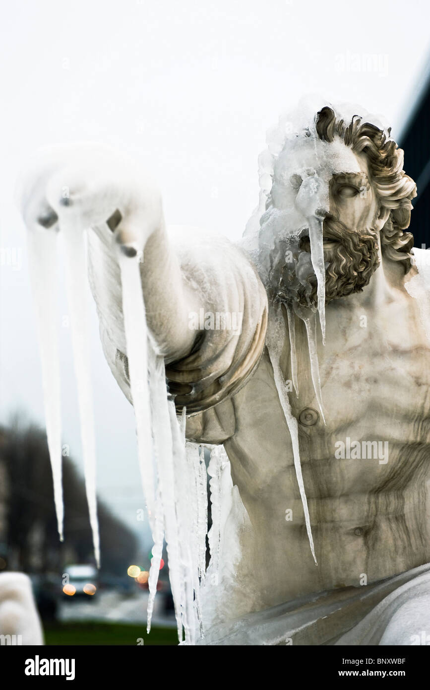 Statue of fierce male figure pointing to distance, face obscured by ...