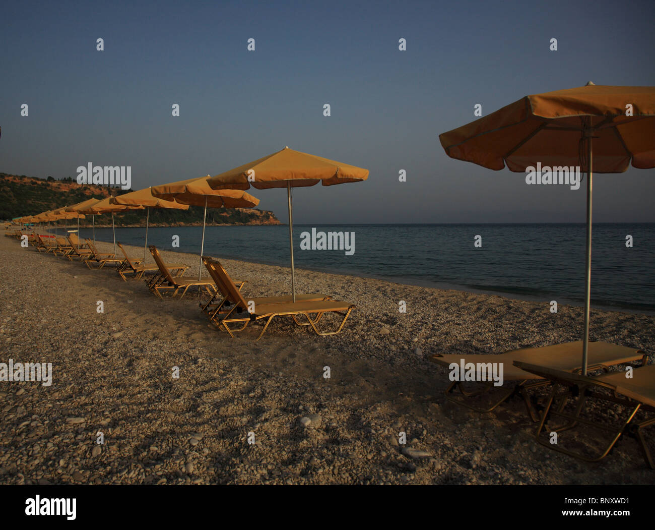 Sunbeds and parasols Lourdas beach Kefalonia Greece Stock Photo - Alamy