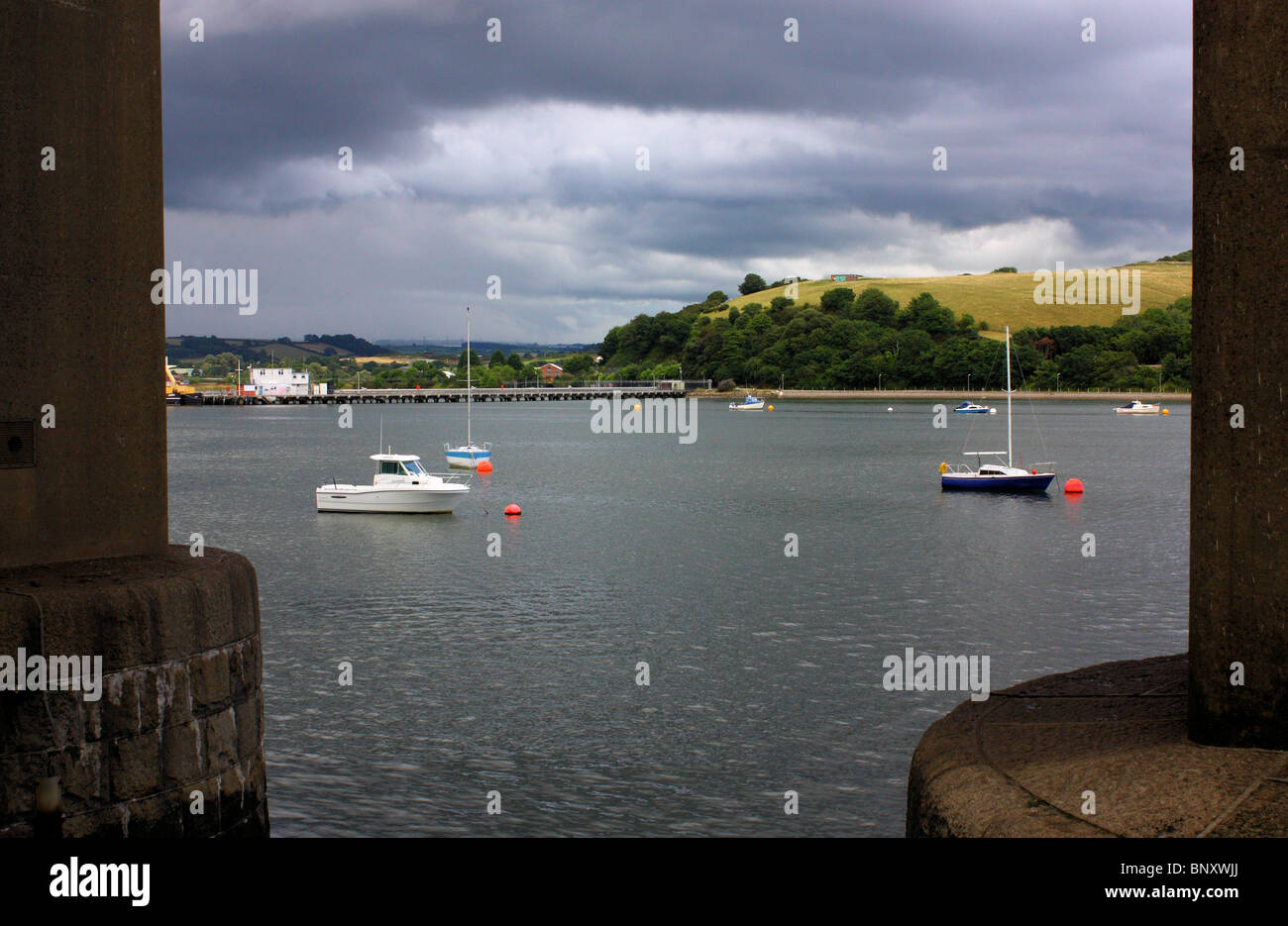 View of the River Tamar between the leg of the Tamar Road Bridge. This ...