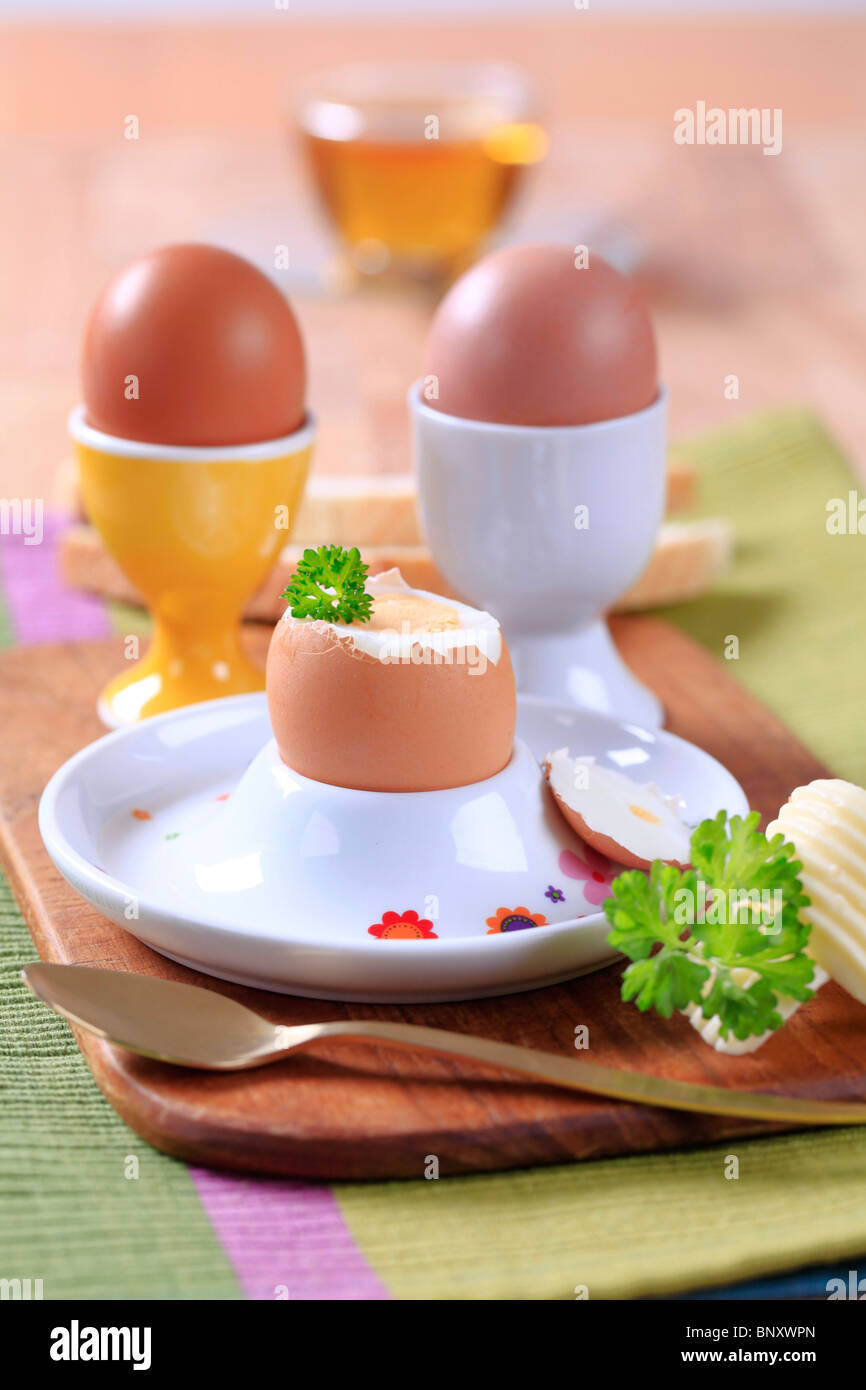 Boiled eggs in porcelain egg cups Stock Photo - Alamy
