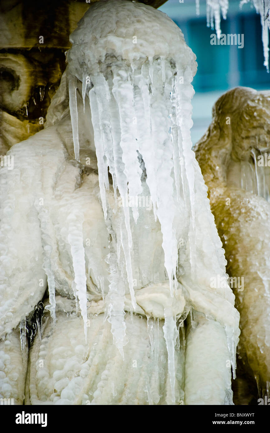 Statue of female figure, face obscured by icicles Stock Photo - Alamy