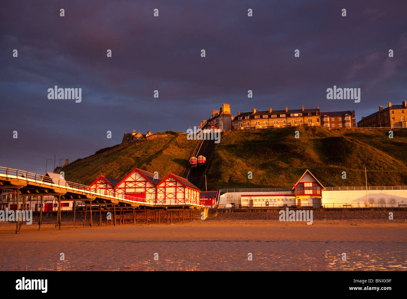 Dramatic golden Sunlight shinning on Saltburn Pier and Victorian Houses ...