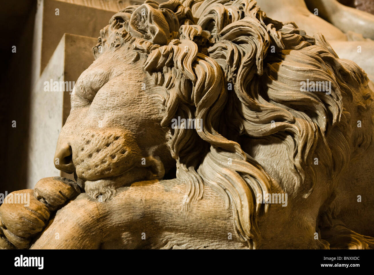Statue of sleeping lion flanking Monument to Clement XIII, St. Peter's ...