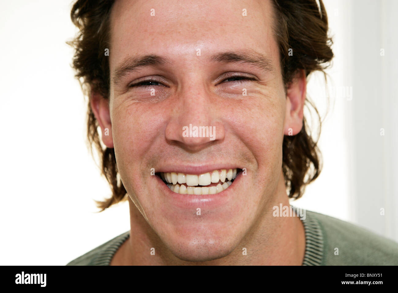 Portrait of male laughing at camera Stock Photo - Alamy