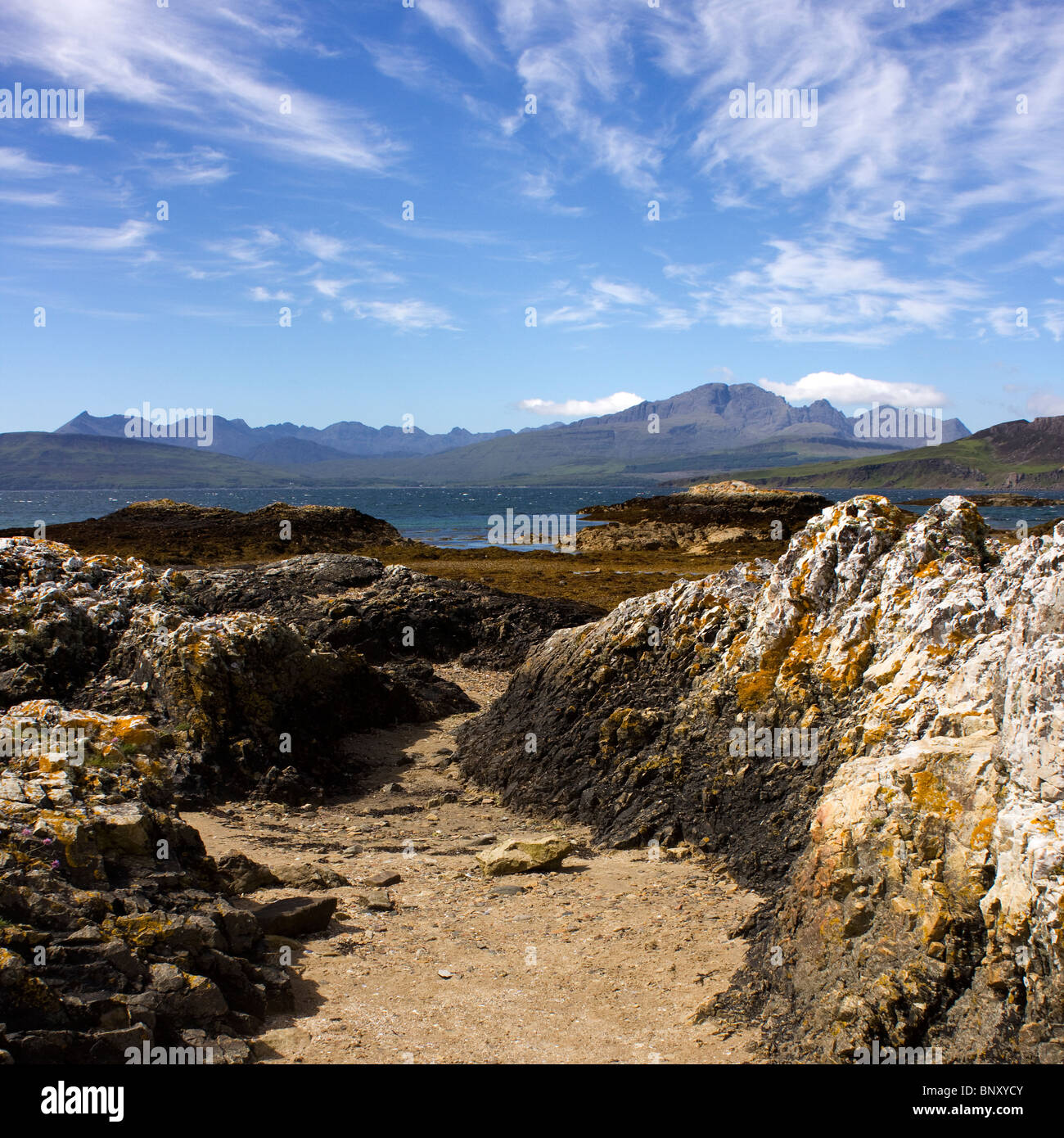 Ord beach on the Isle of Skye with blue sky, white cirrus clouds, Loch ...
