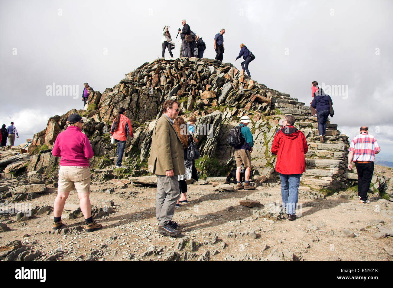 Hikers crowd Mount Snowdon summit, Snowdonia National Park, North Wales ...
