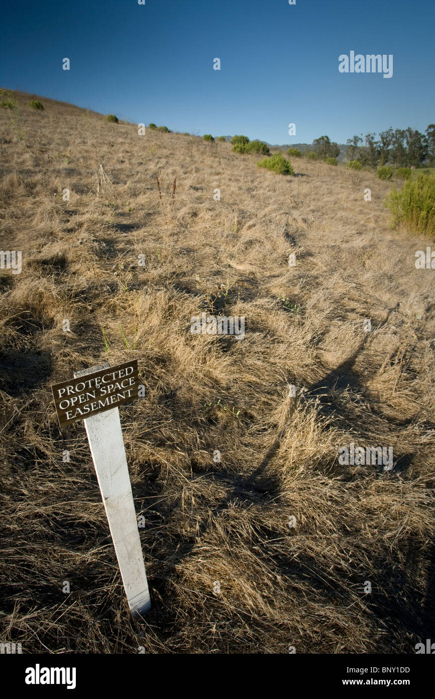 Protected open space easement sign on grassy hillside Stock Photo - Alamy