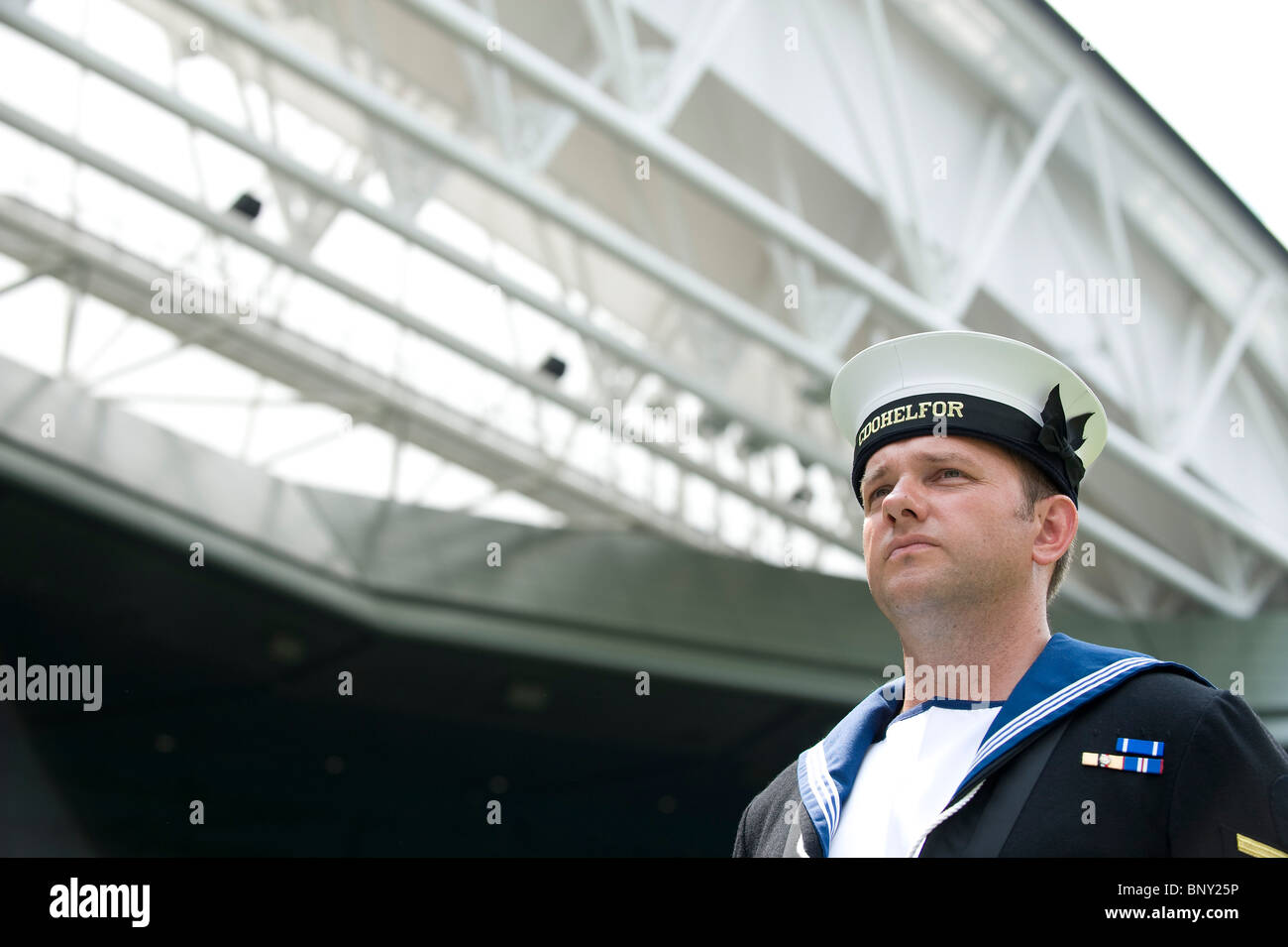 A service steward from the Navy stands on centre court during the ...