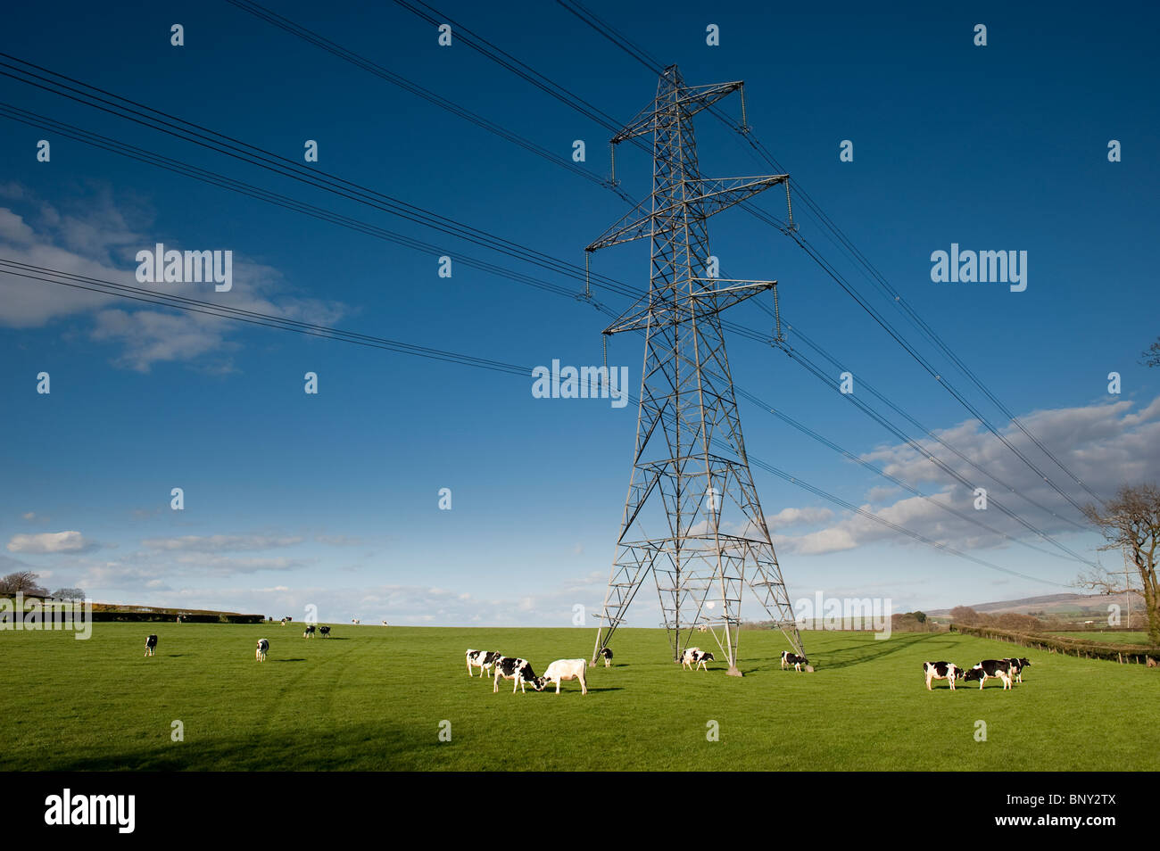 High Power electricity pylons crossing countryside in England with ...
