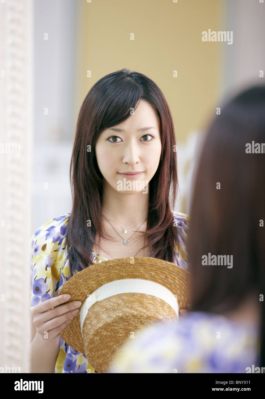Young woman getting ready Stock Photo - Alamy