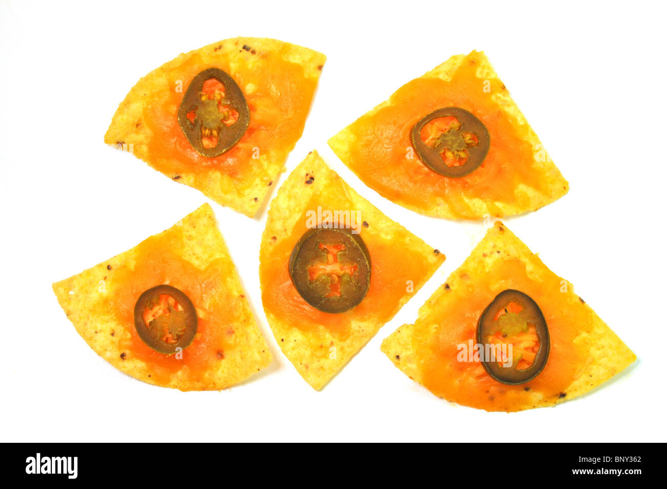 Five nachos with melted cheddar cheese and sliced jalapeno peppers ...