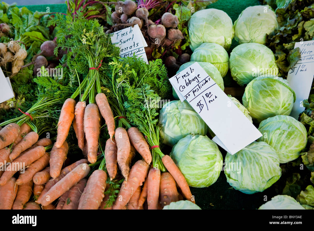 A produce stand at farmers market with organic vegetables, Santa ...