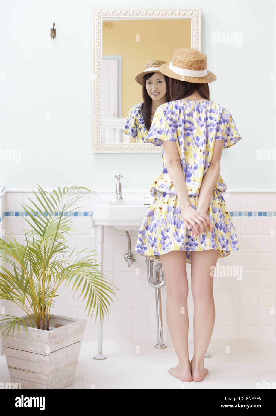 Young woman getting ready Stock Photo - Alamy