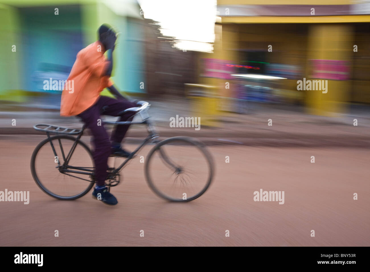 Bicycles riding through town - Lira, Uganda, East Africa Stock Photo ...