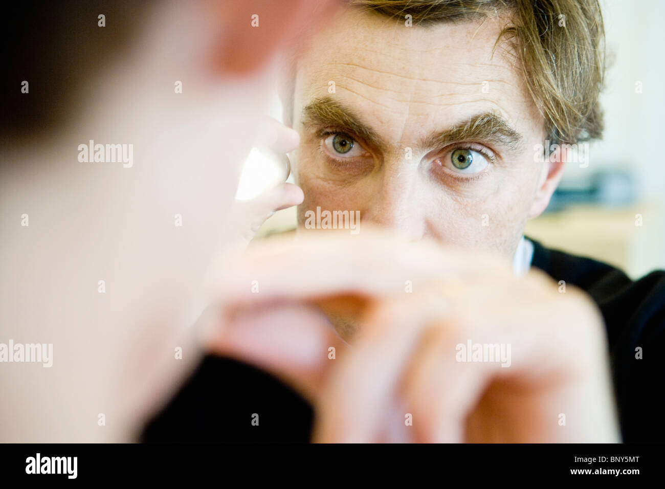 Doctor examining patient Stock Photo - Alamy