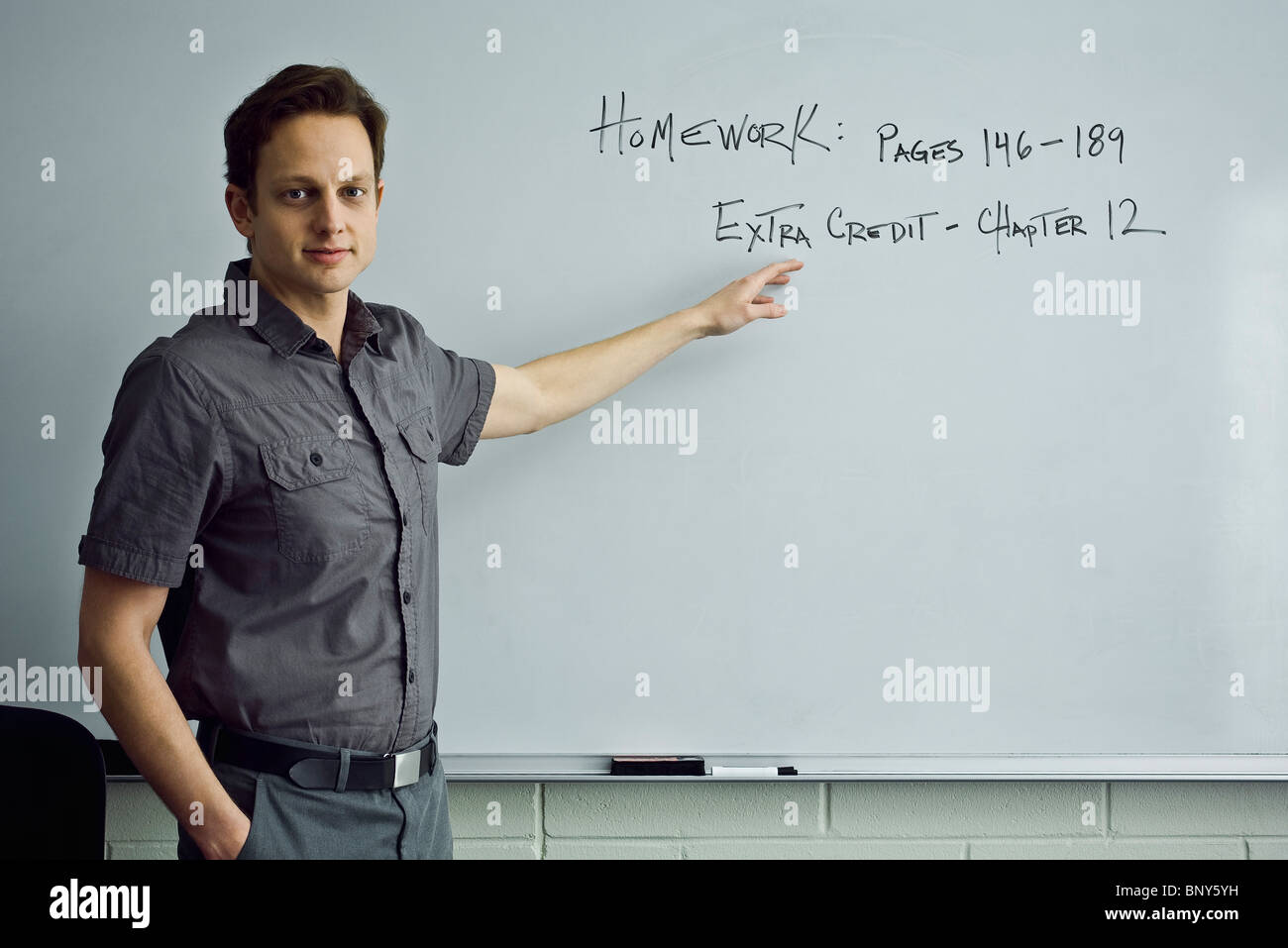 Teacher explaining homework assignment Stock Photo - Alamy