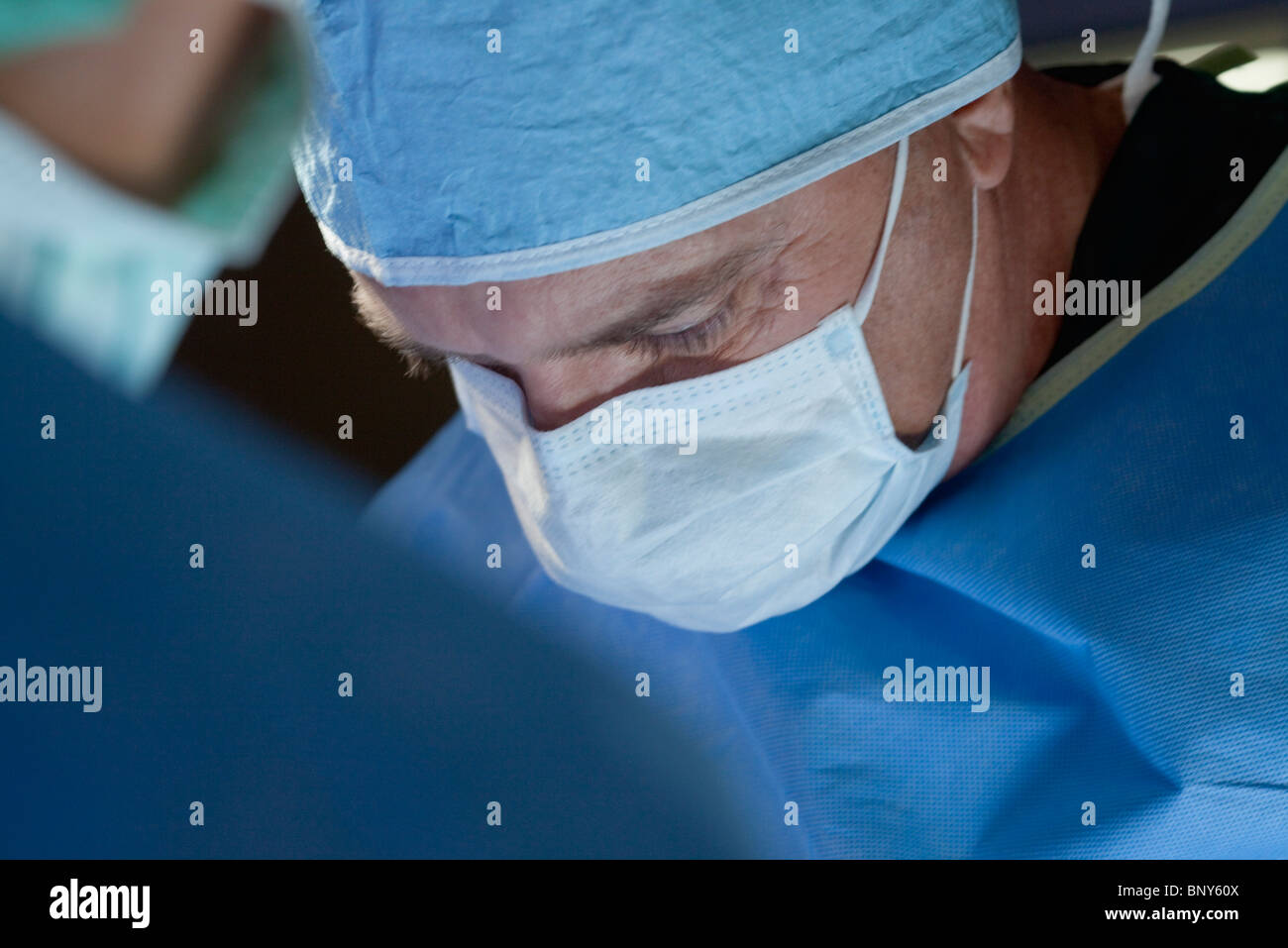 Surgeon focusing on surgical procedure Stock Photo - Alamy